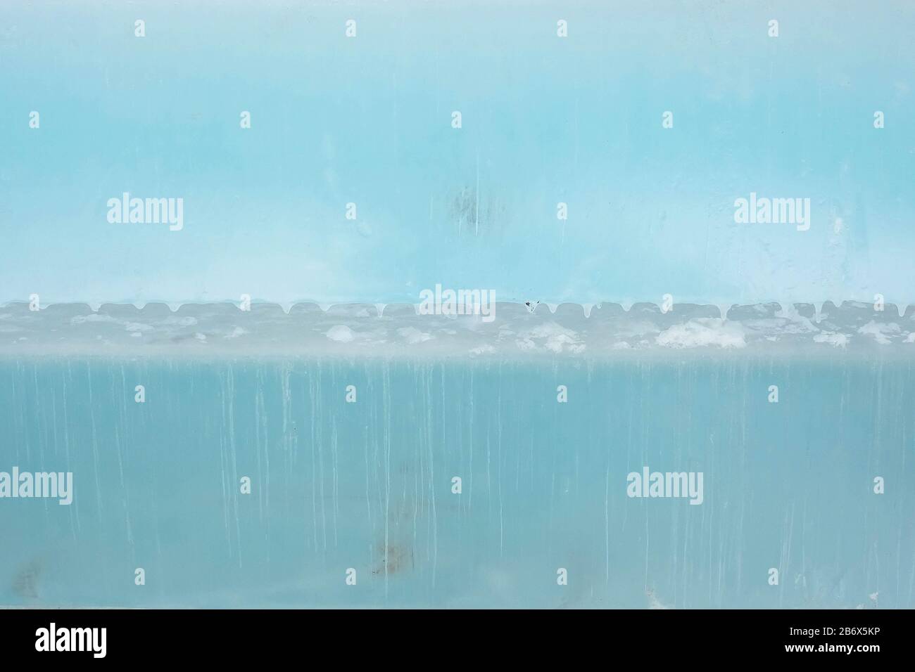 Ice blocks. Large frozen bricks of ice. Blue background Stock Photo - Alamy