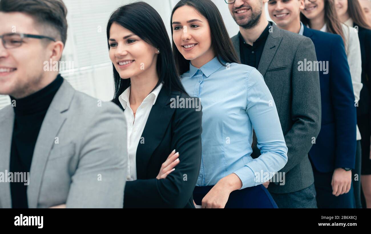 successful businessman standing ahead of his business team. the concept ...