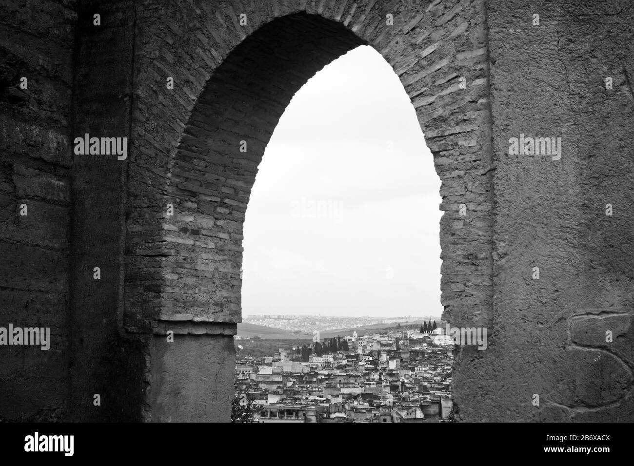 A view of Fes, Morocco, through a stone arch Stock Photo - Alamy