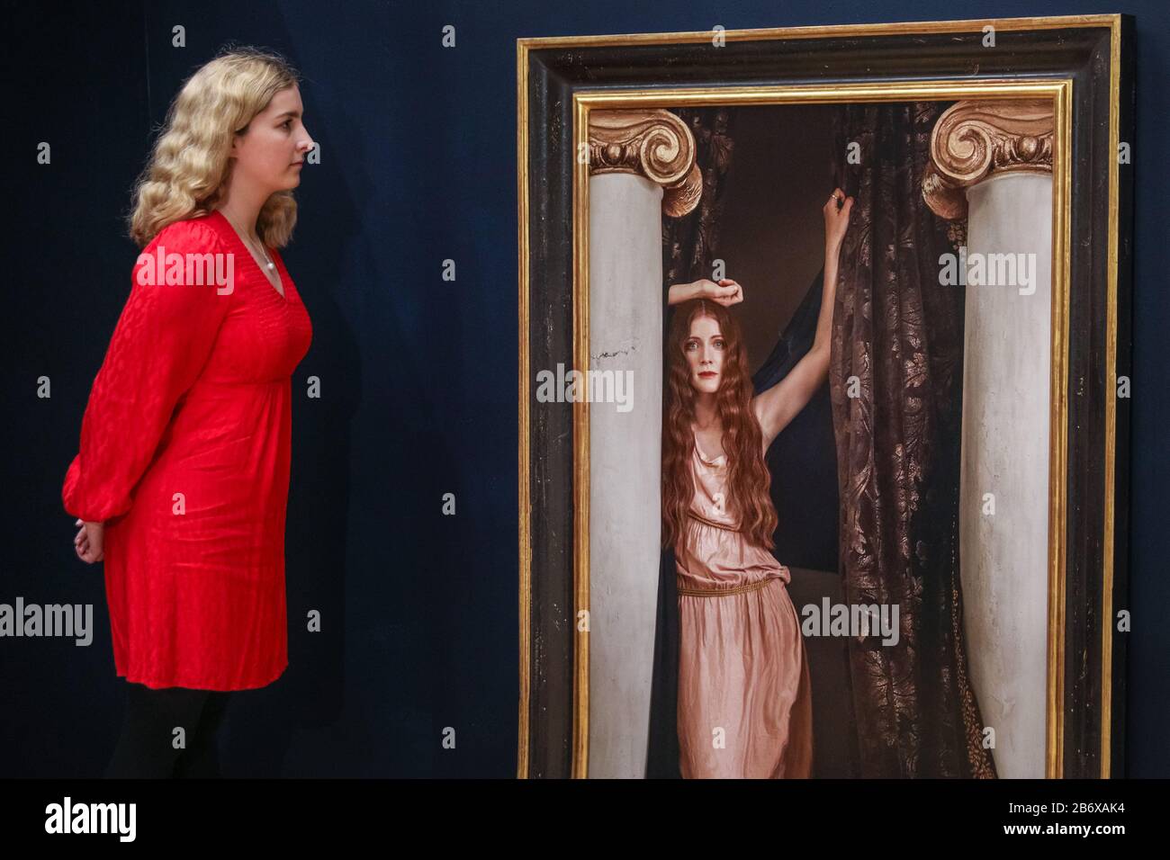London, UK. 12th Mar, 2020. An assistant poses with Maisie Broadhead's ...