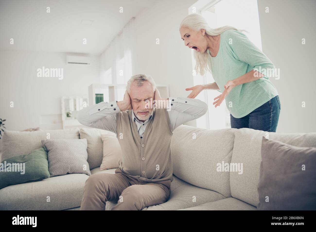 Photo of two sad upset people having great scandal. Angry old lady ...