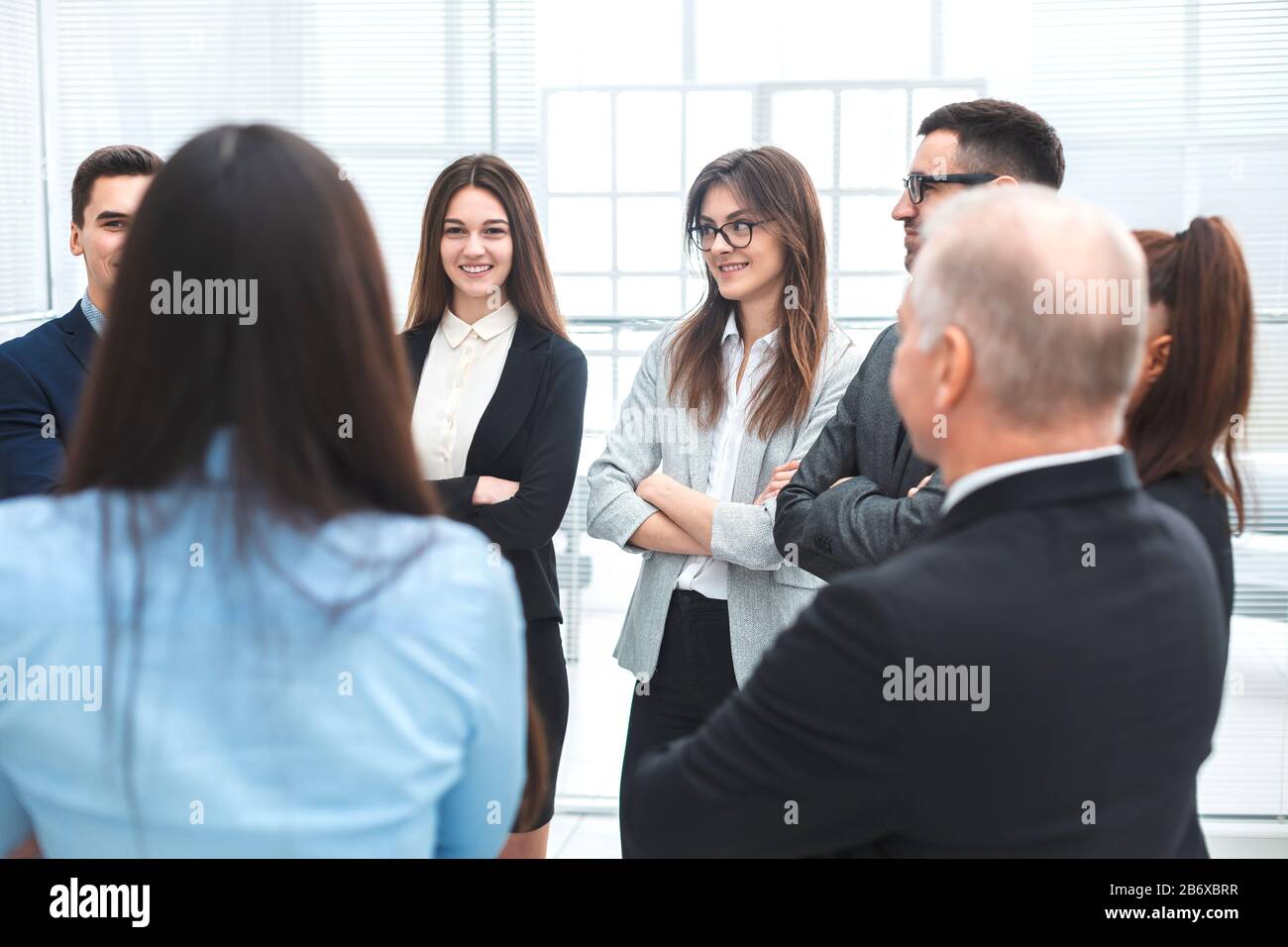 close up. a group of employees discussing new ideas Stock Photo - Alamy