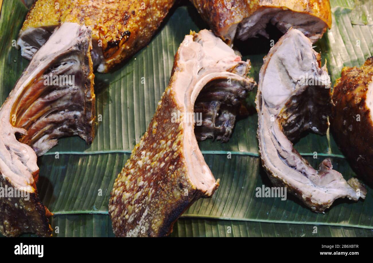 roasted crispy pork skin texture on banana leaf Stock Photo - Alamy