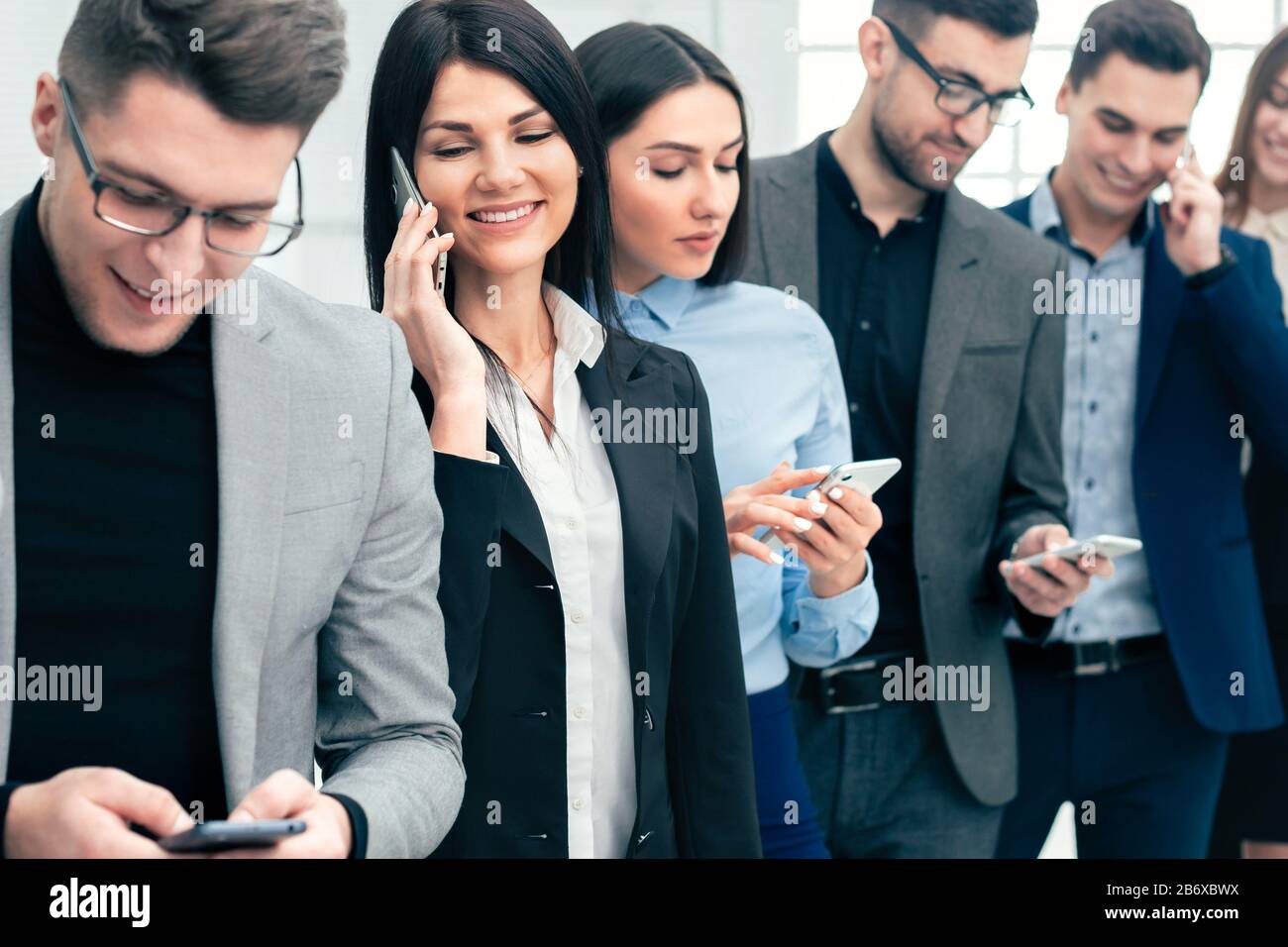 group of diverse young people use their smartphones Stock Photo - Alamy