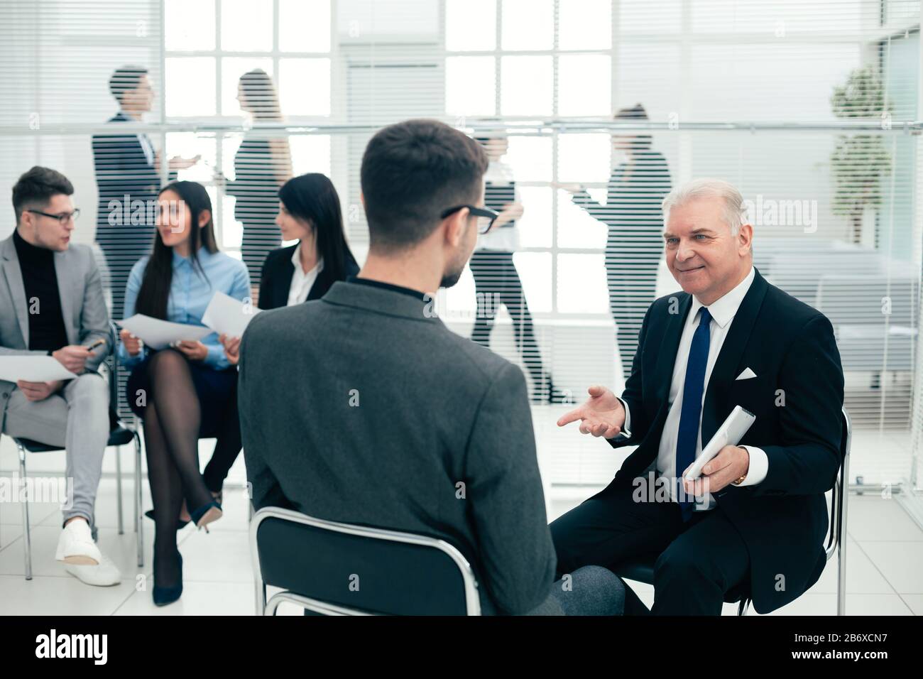 Manager explaining something staff hi-res stock photography and images ...