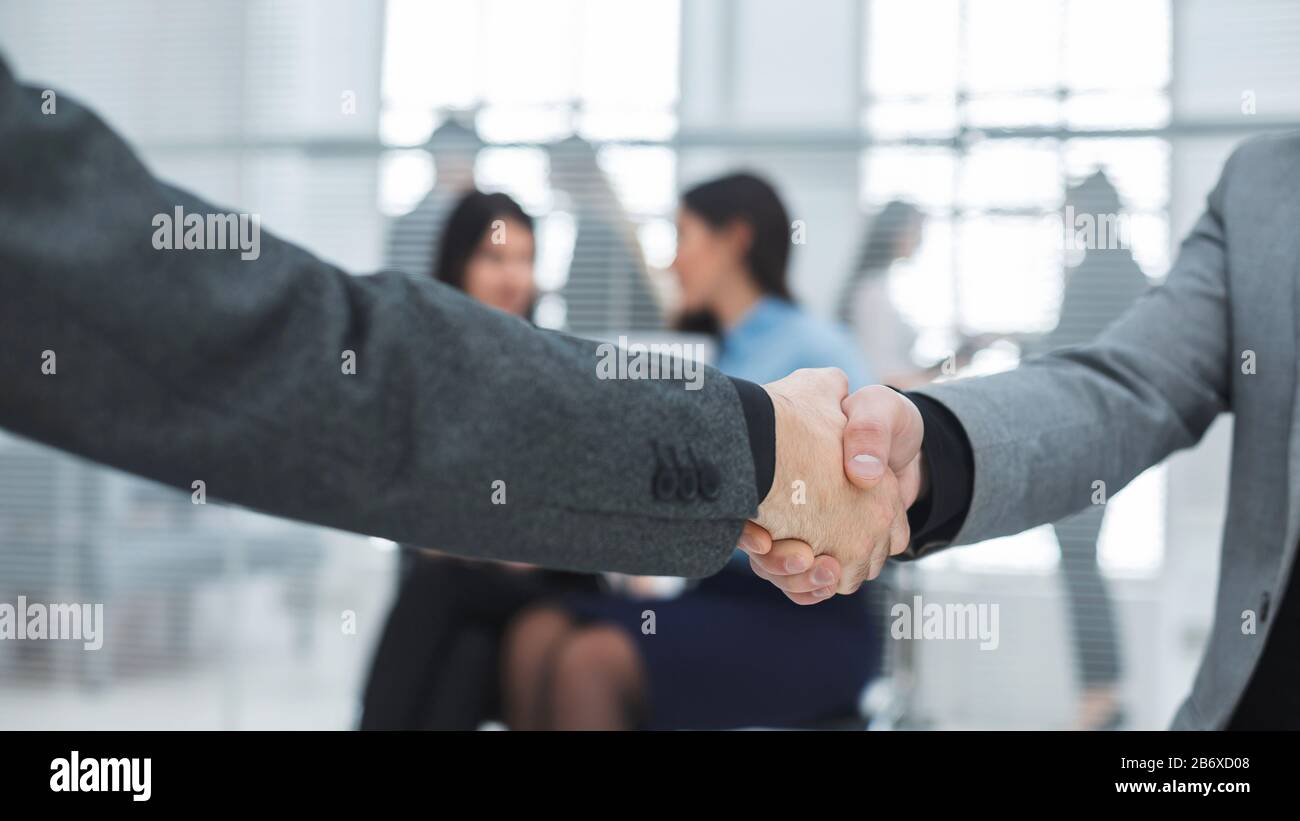 close up. business handshake on office background Stock Photo - Alamy