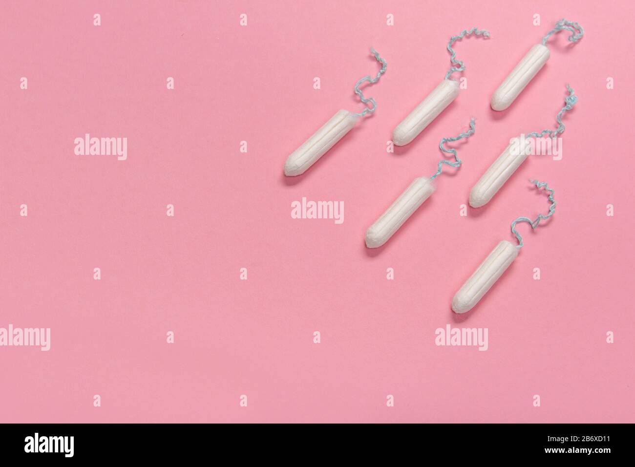 Group of tampons seen from a high angle view on a pink background with ...