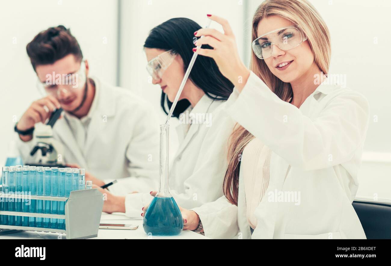 close up.a team of scientists conduct fluid research Stock Photo - Alamy
