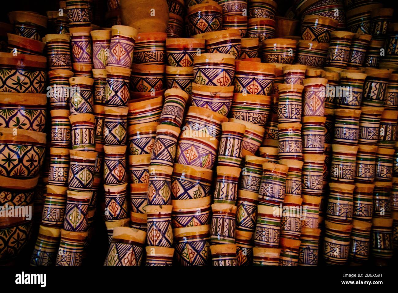 Painted clay pots stacked in a workshop in Fes, Morocco Stock Photo - Alamy
