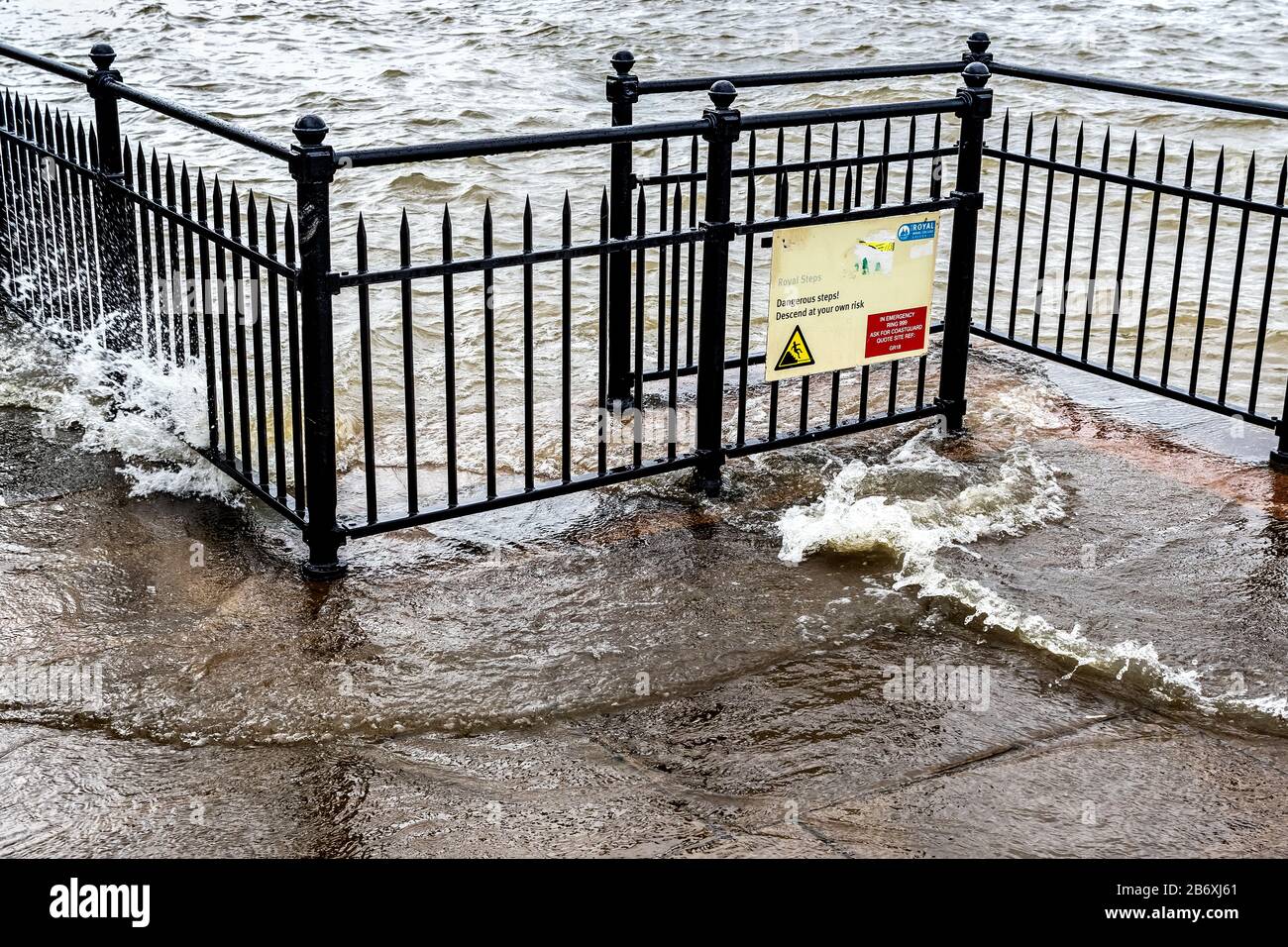 River Thames overflowing flooding the walkway footpath in front of the ...