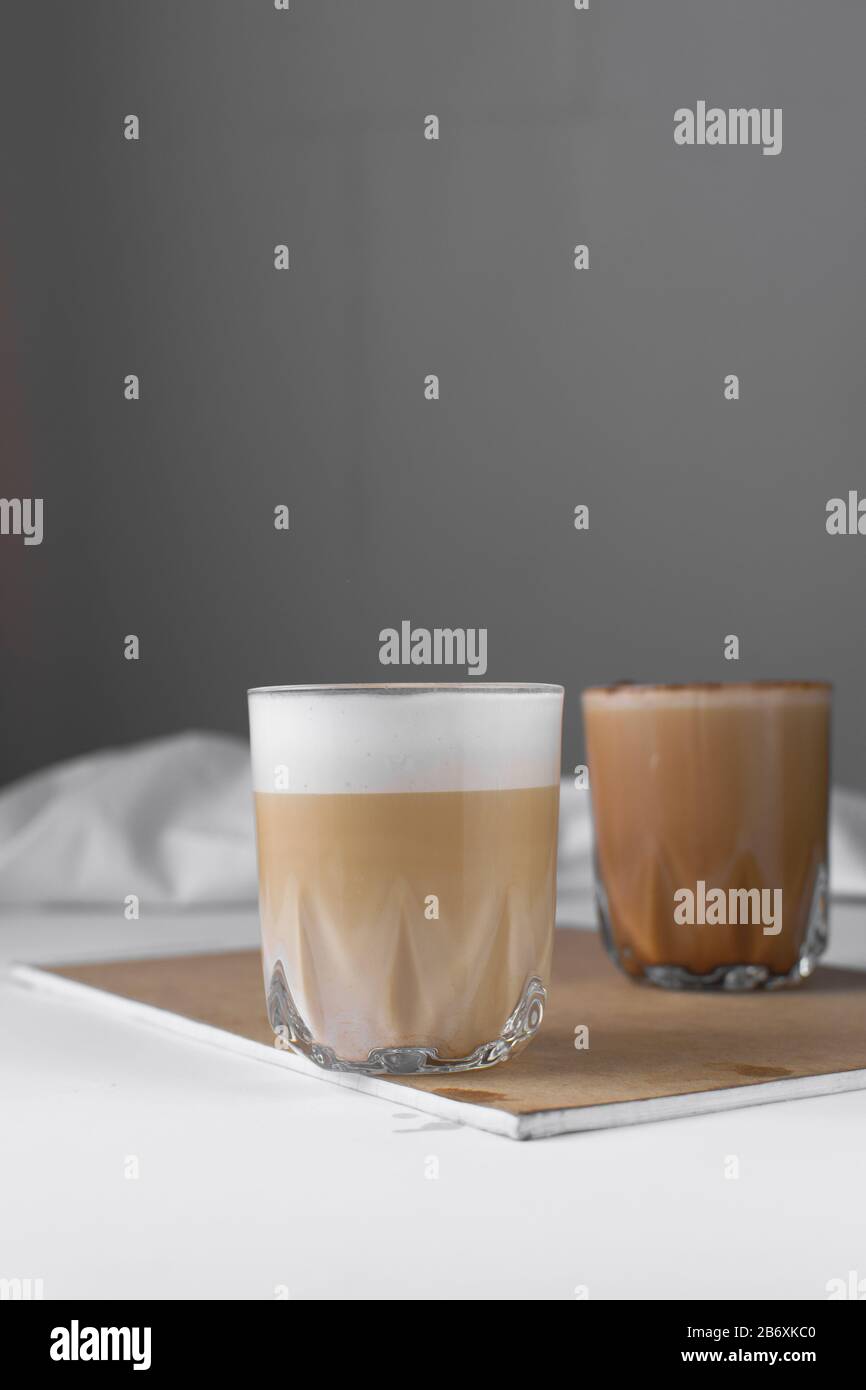 Cafe latte and Cortado in glass cups Stock Photo - Alamy