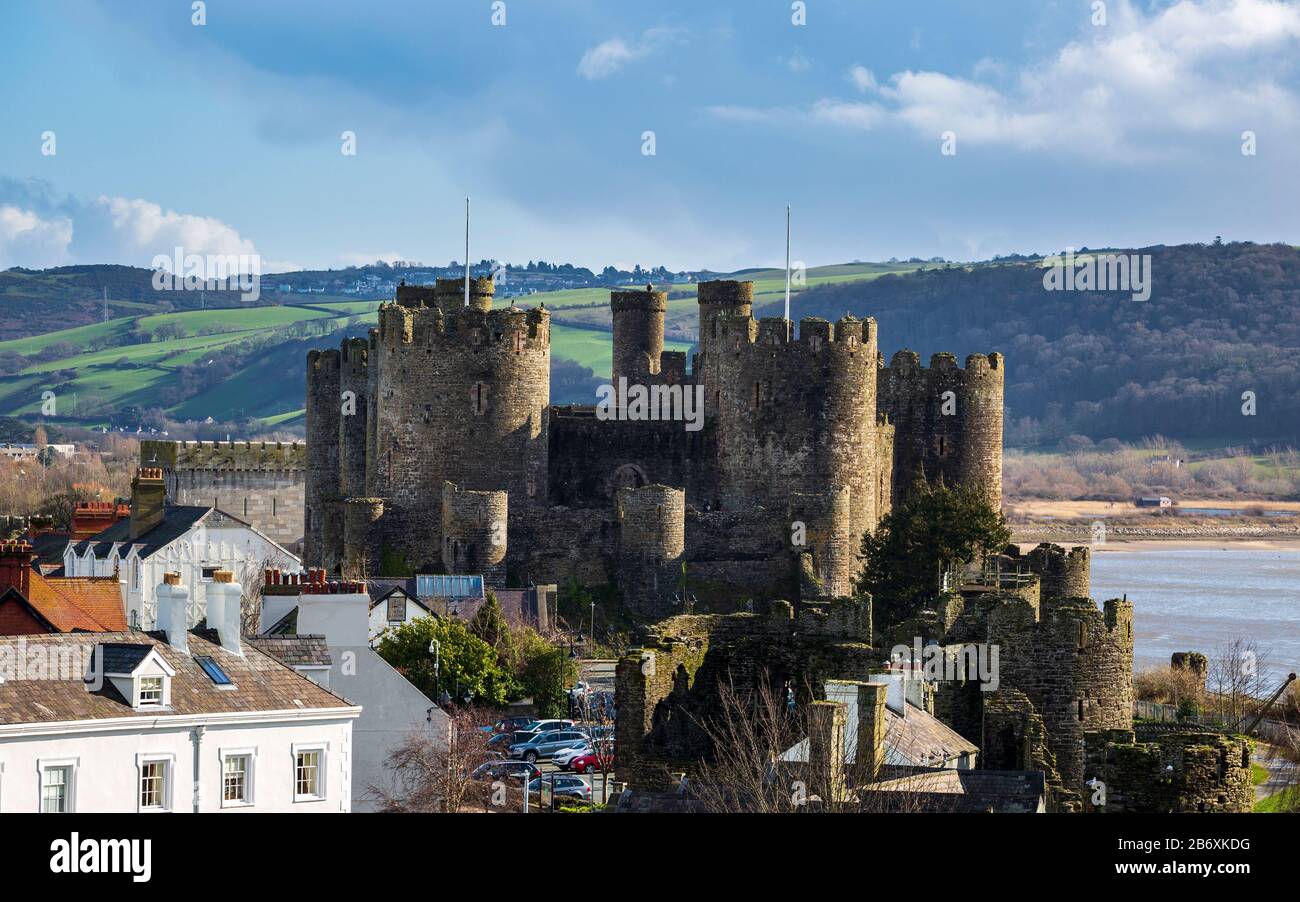 Conwy castle across the roof tops from the town wall fortifications ...