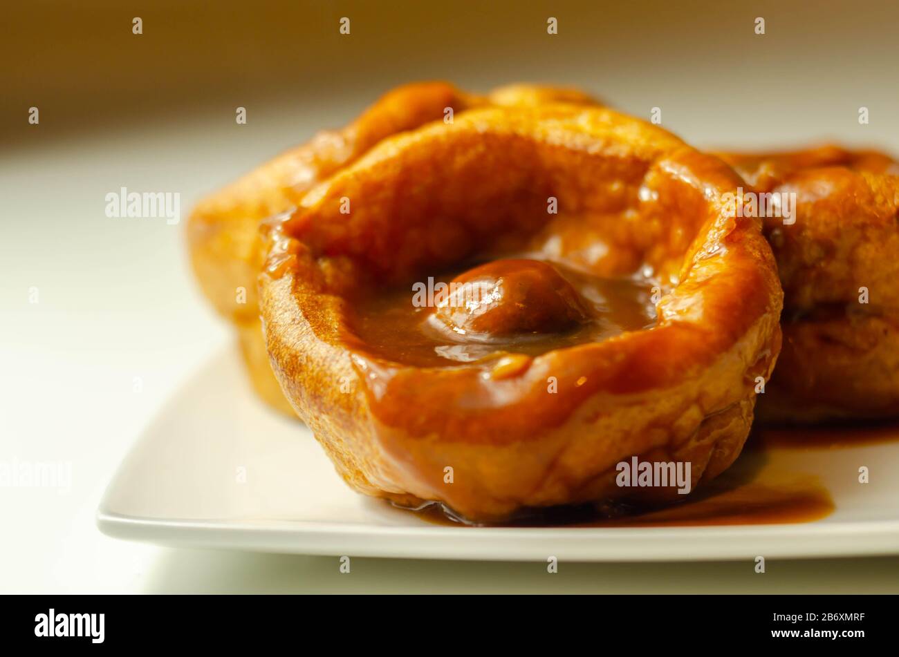 Traditional English Yorkshire pudding with meatballs and thick gravy ...
