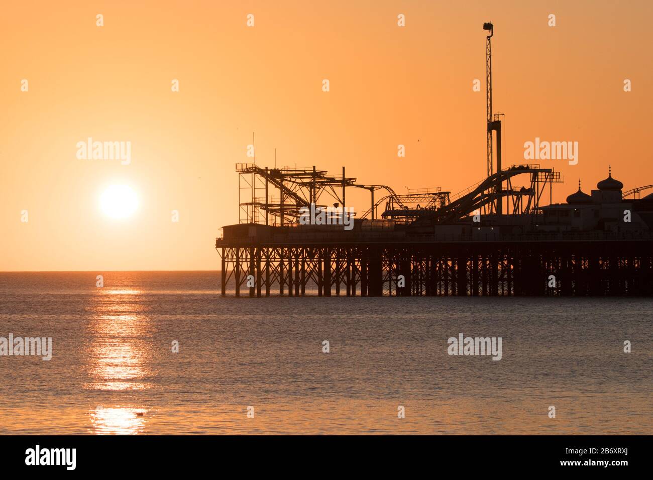 Palace Pier at sunset on Brighton seafront. Sussex, UK Stock Photo - Alamy