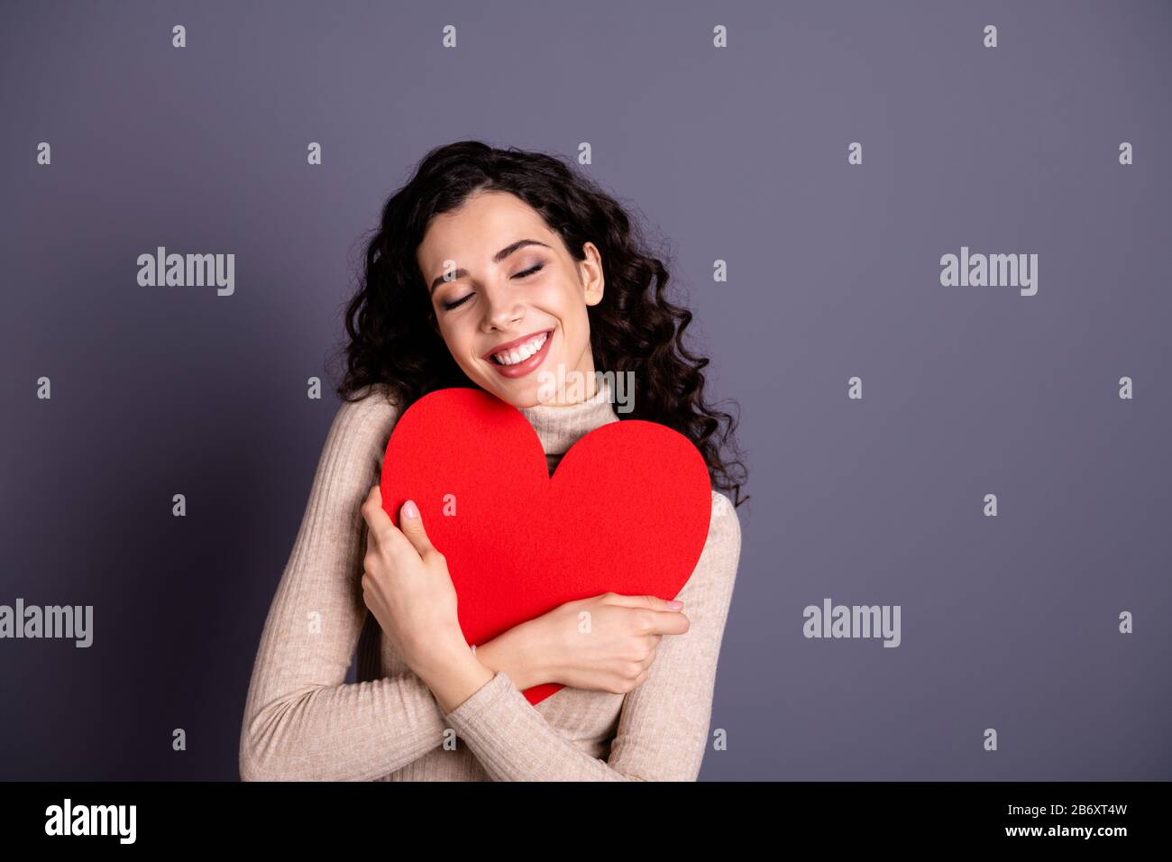 Close up photo beautiful she her lady overjoyed hands arms hold big ...