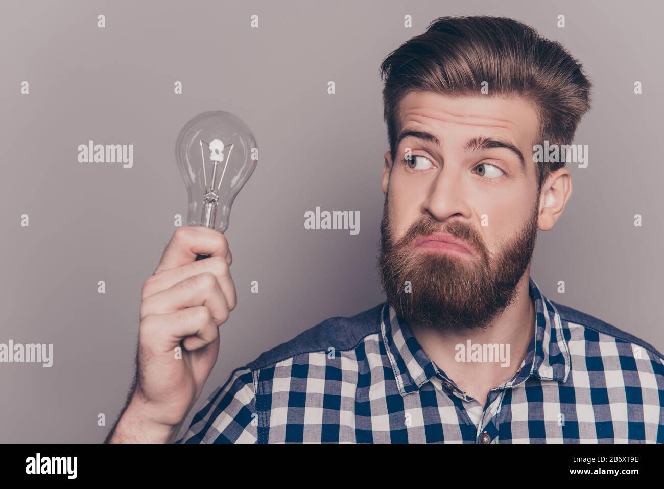Portrait of young genious man with idea holding lamp Stock Photo - Alamy