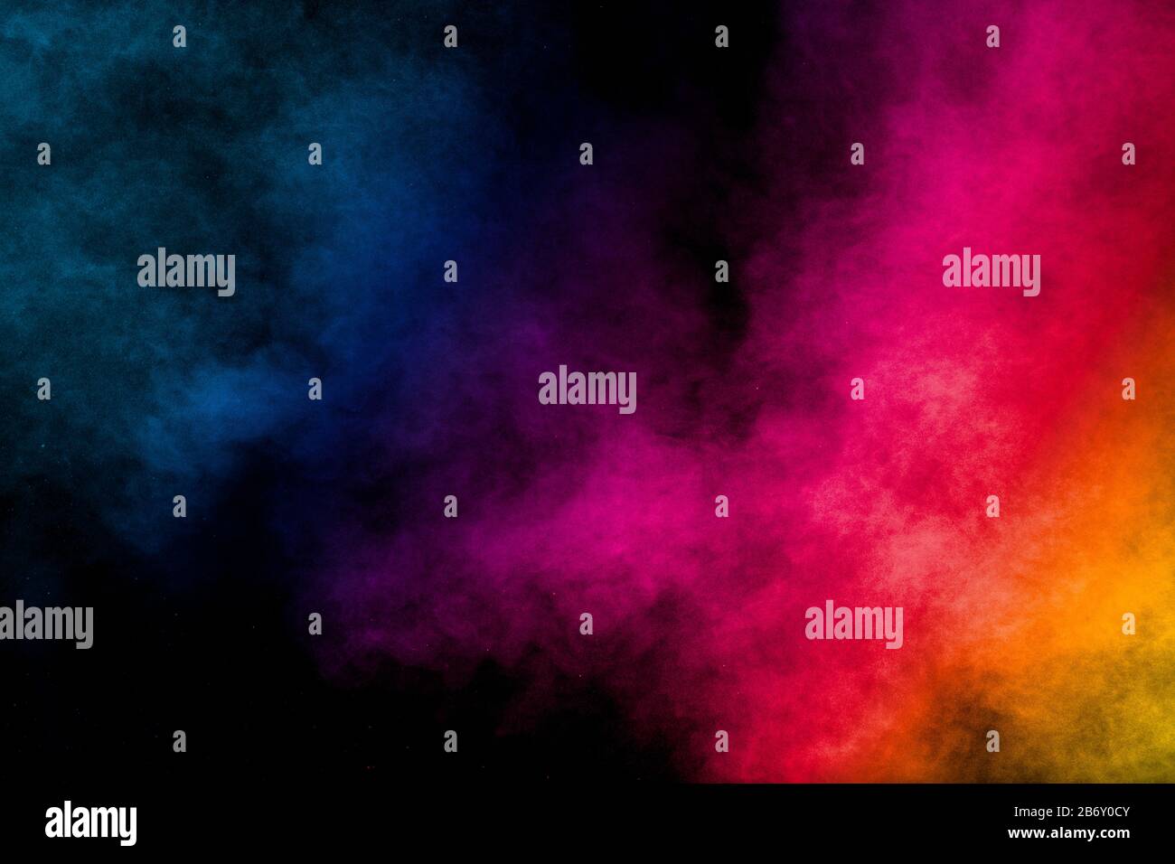 Multi colored particles explosion on black background.Colorful dust ...