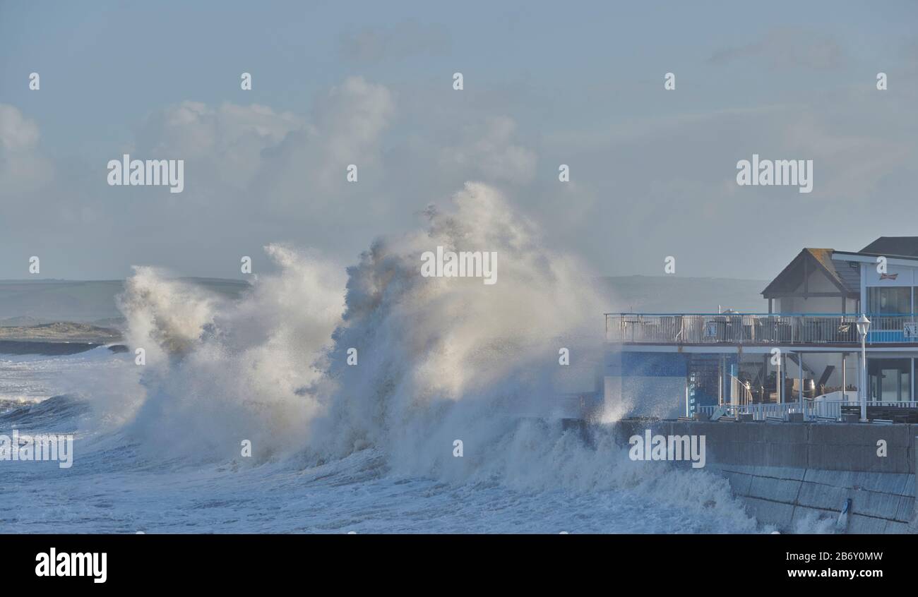 Large waves crash into the Beach Bar at Westward Ho! , Devon during an ...