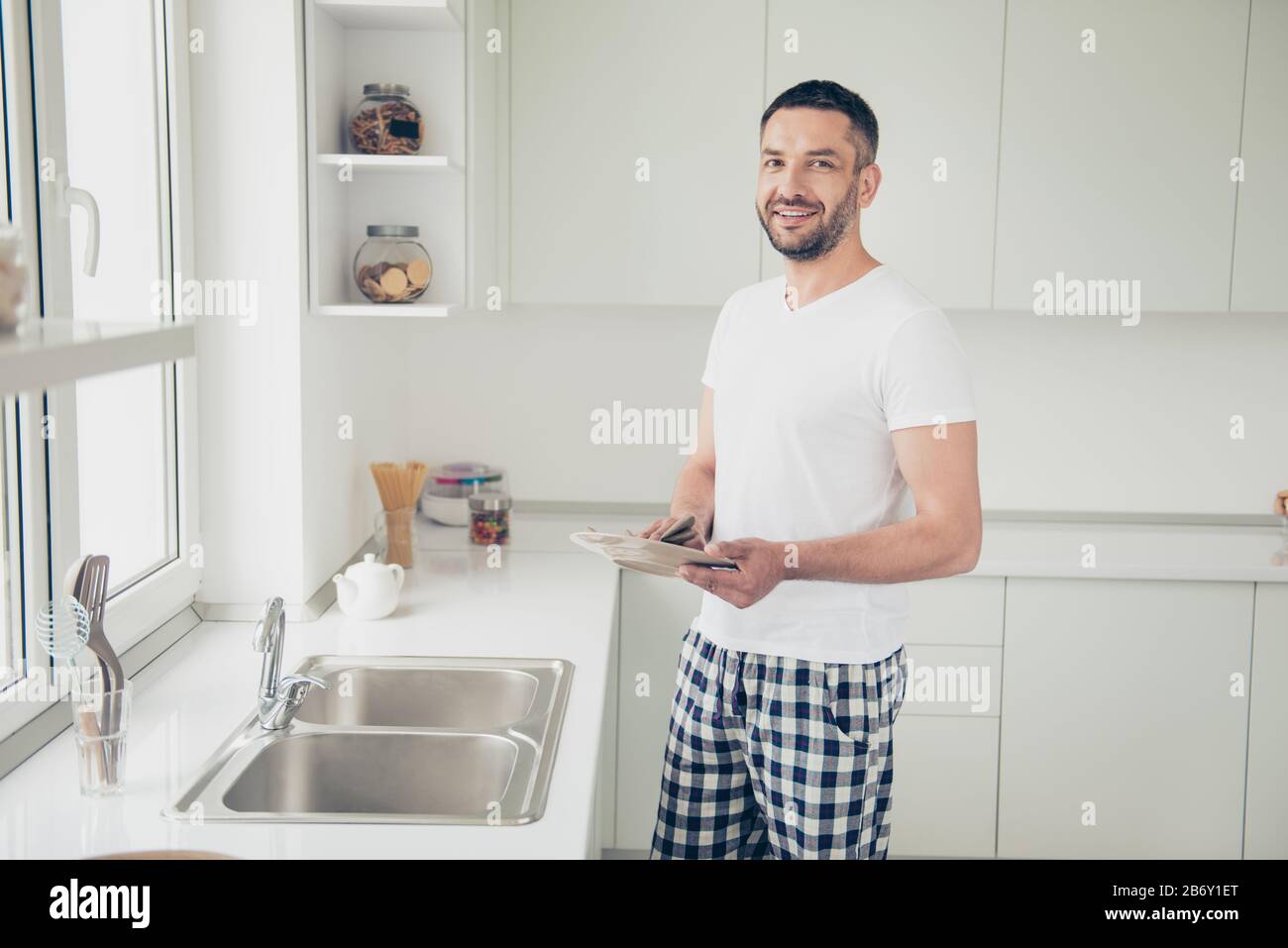 Close up photo attractive he him his homey guy arms hands clean plate ...