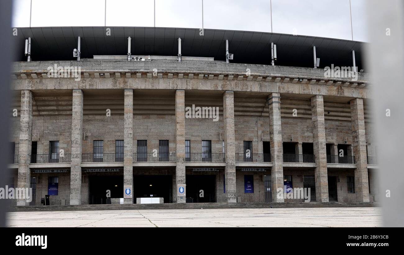 Berlin, Germany. 11th Mar, 2020. Clouds hang over the Olympiastadion in ...