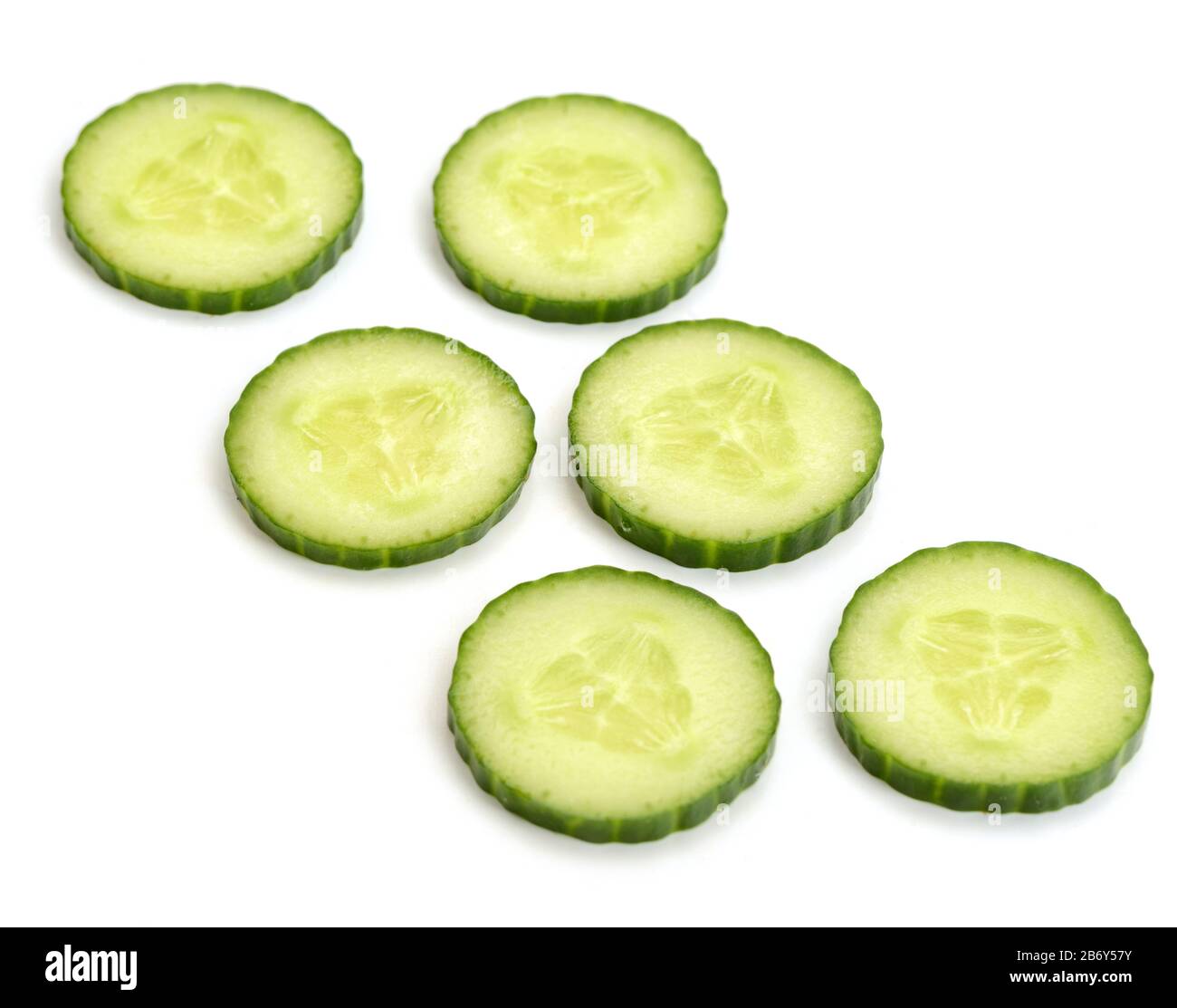 Fresh cucumber circle slices on white background Stock Photo - Alamy