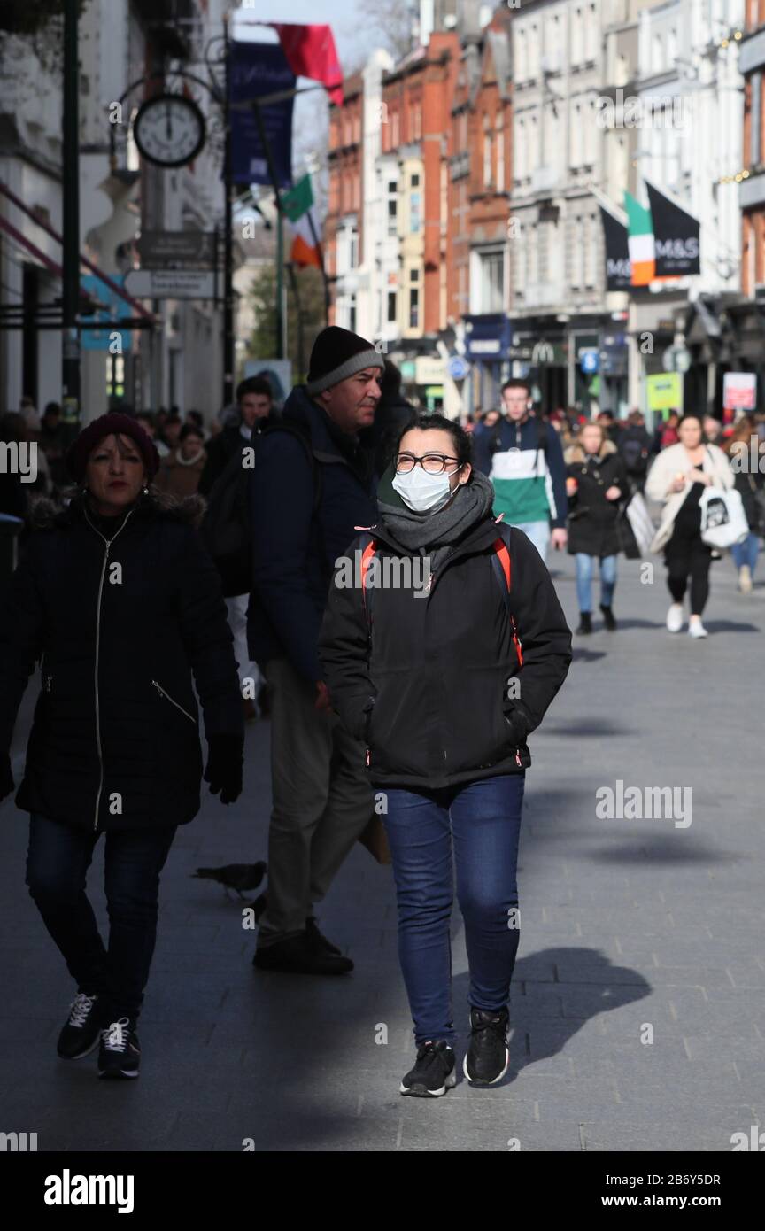 A woman wearing a mask to protect against the spread of coronavirus ...