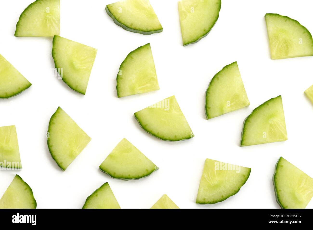 Cucumber quarter slices on white background Stock Photo - Alamy