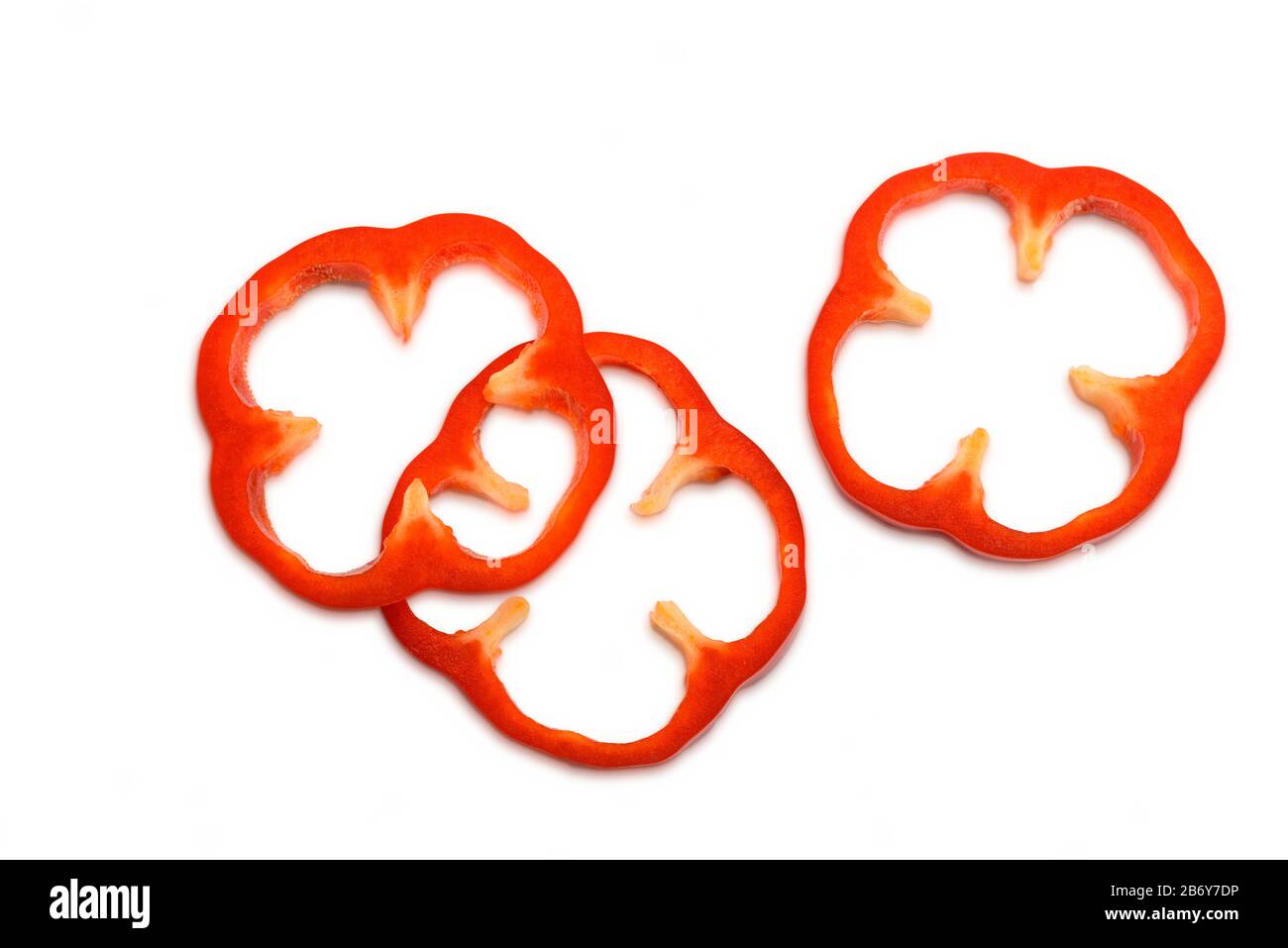 Beautiful red bell pepper rings on white background Stock Photo - Alamy