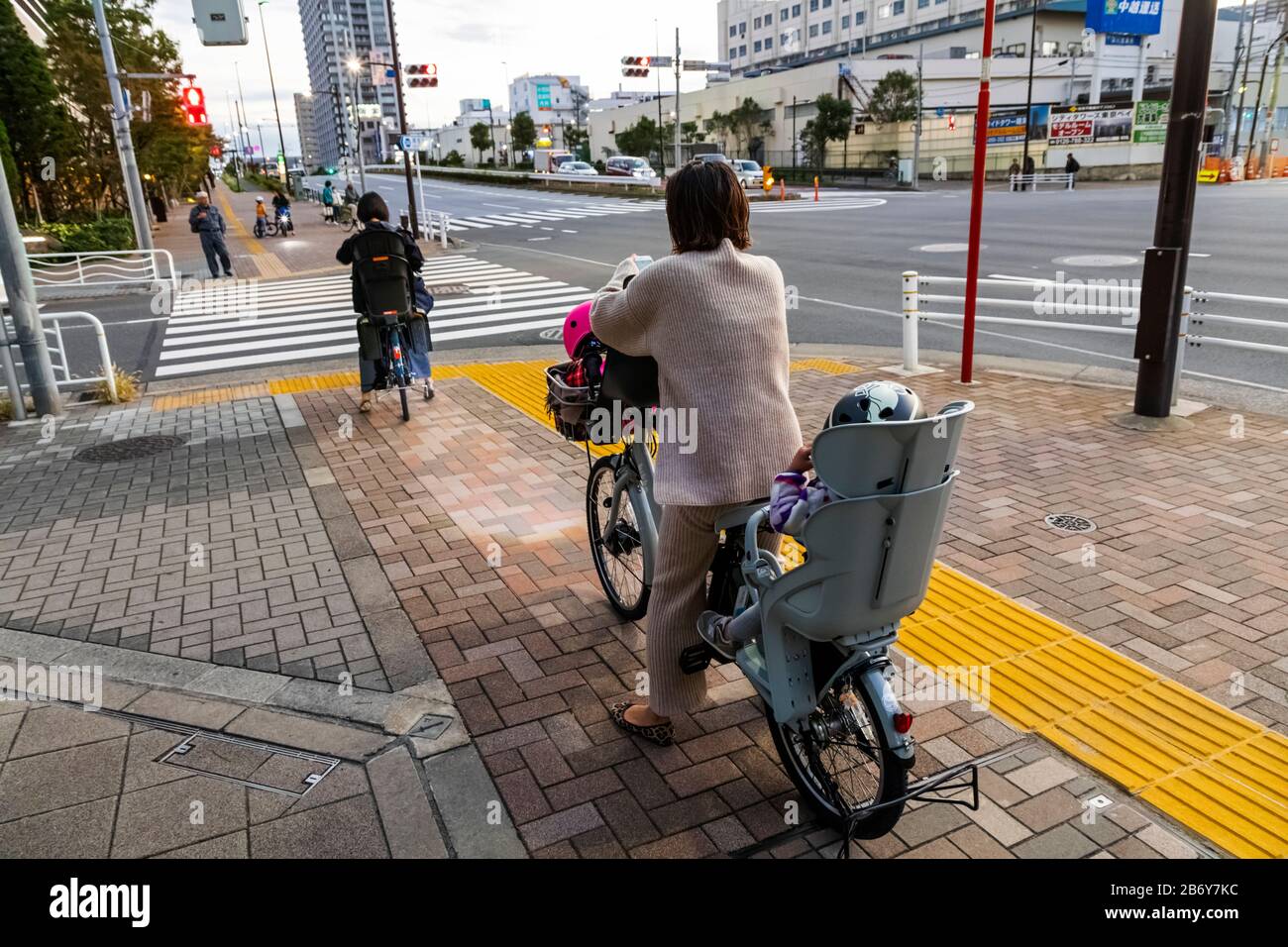 Tokyo woman riding bicycle hi-res stock photography and images - Alamy
