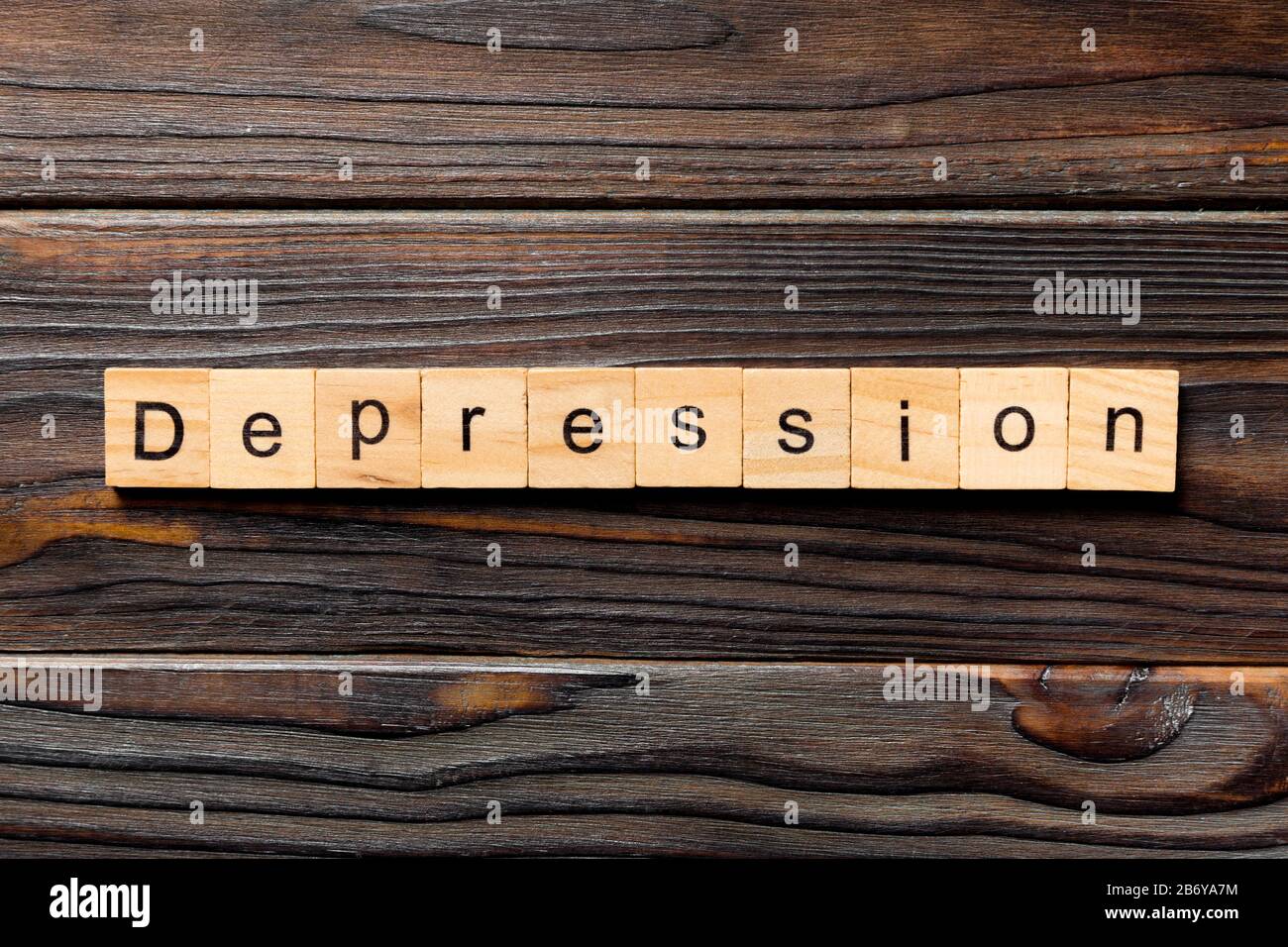 Depression word written on wood block. Depression text on table ...