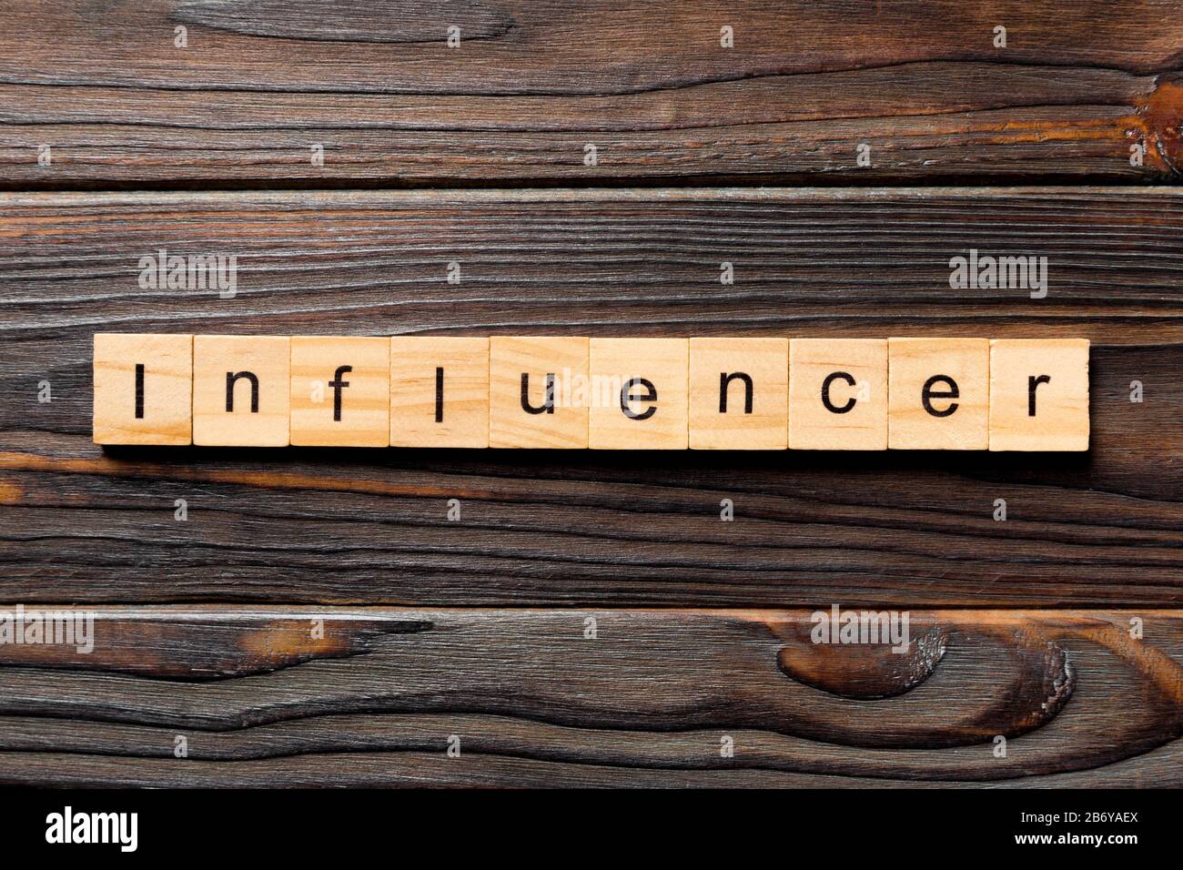 influencer word written on wood block. influencer text on table ...
