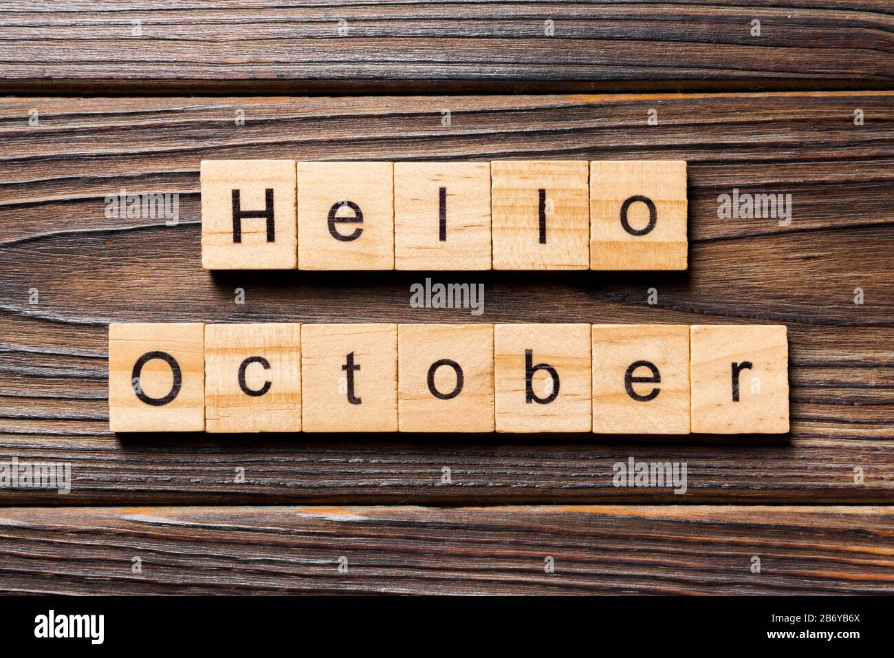 Hello October word written on wood block. Hello October text on table ...