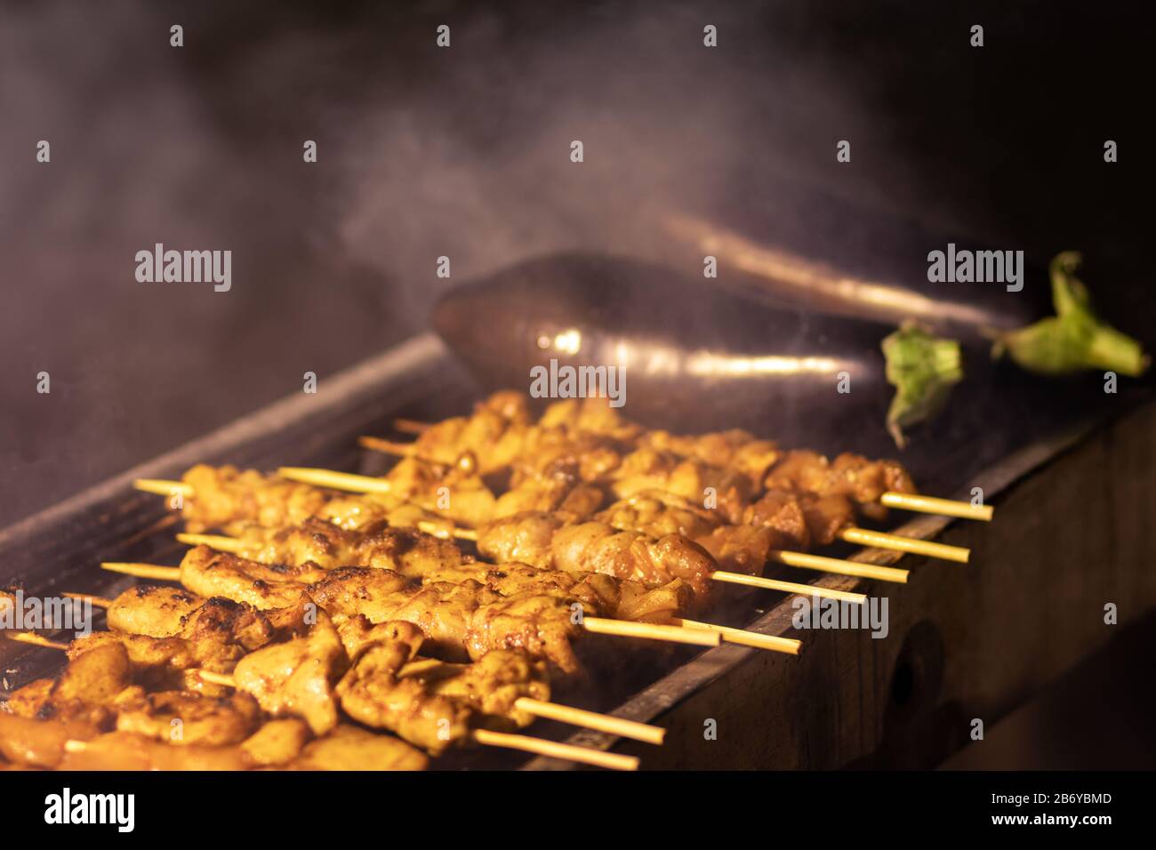Chicken chunks skewers, grill, barbecue. On a metal bbq. In the ...
