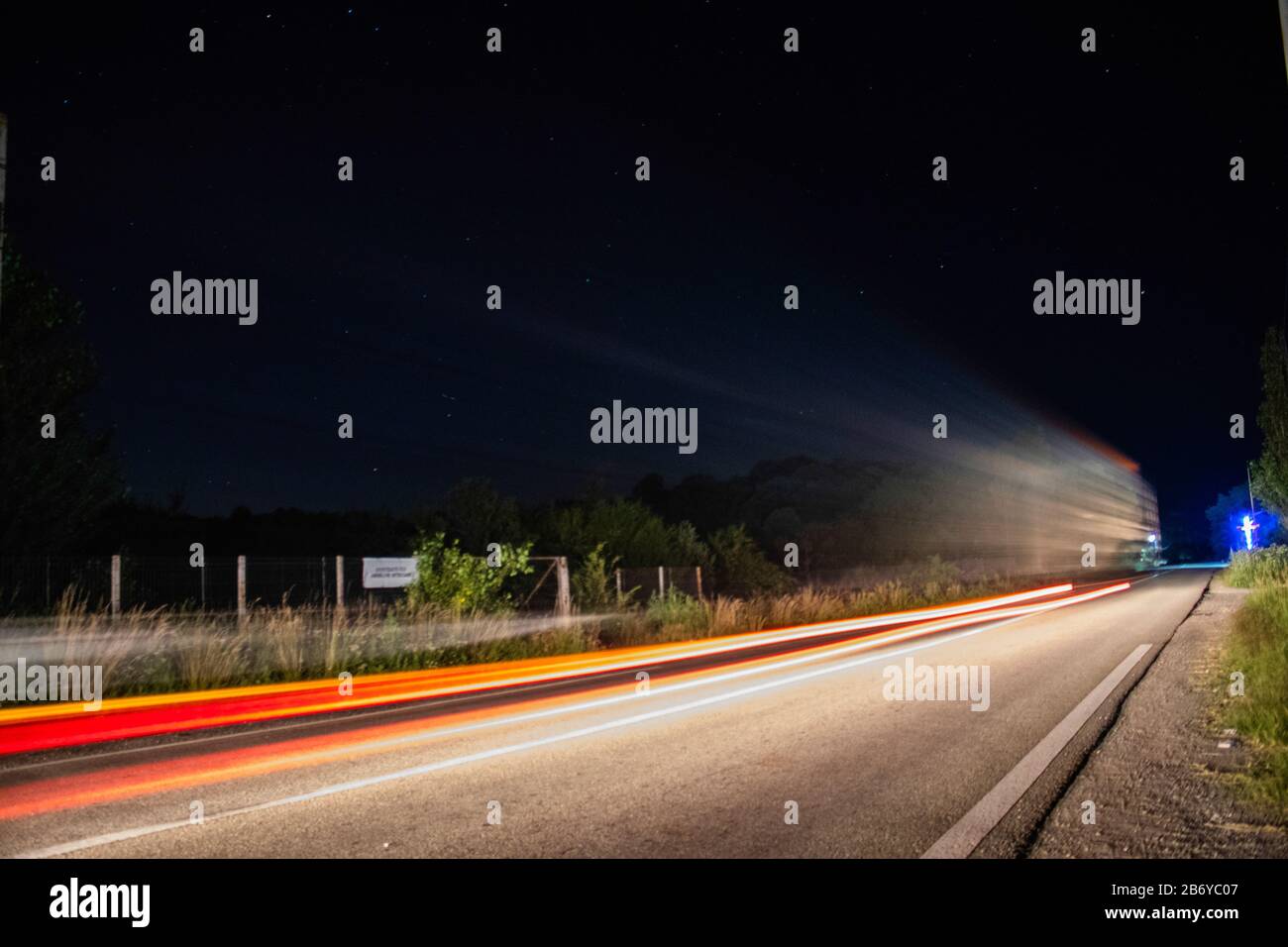 Light trail of a truck passing Stock Photo - Alamy