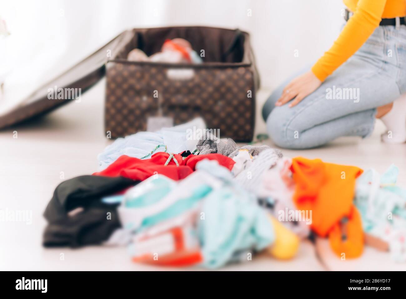 Woman collect clothes floor hi-res stock photography and images - Alamy