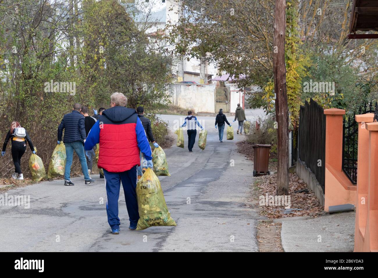 People gathering litter from nature Stock Photo - Alamy
