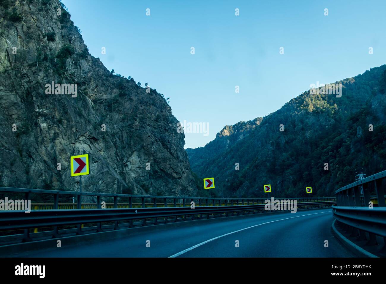 Road crossing through mountain pass Stock Photo - Alamy