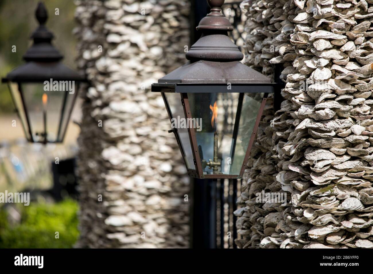 Architectural detail of gas lamps on oyster shell wall in South ...