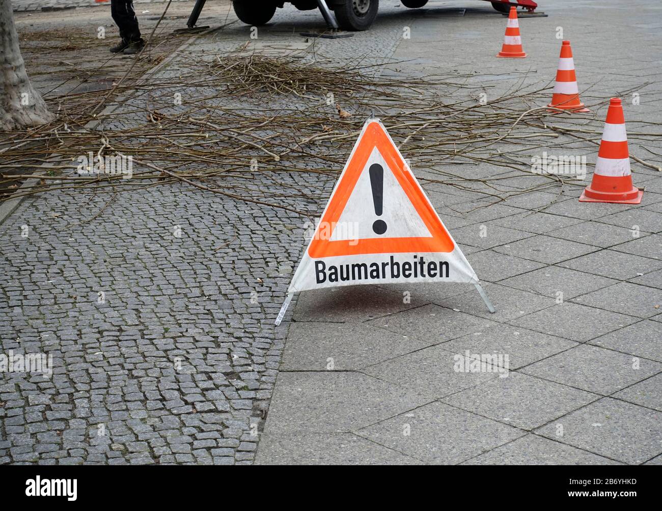 Triangular warning sign tree work Stock Photo - Alamy