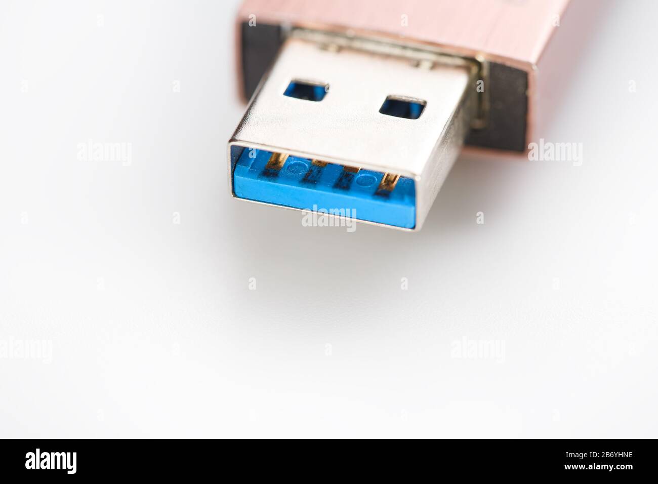 USB flash drive 3 plug closeup on a white background. Storage in ...