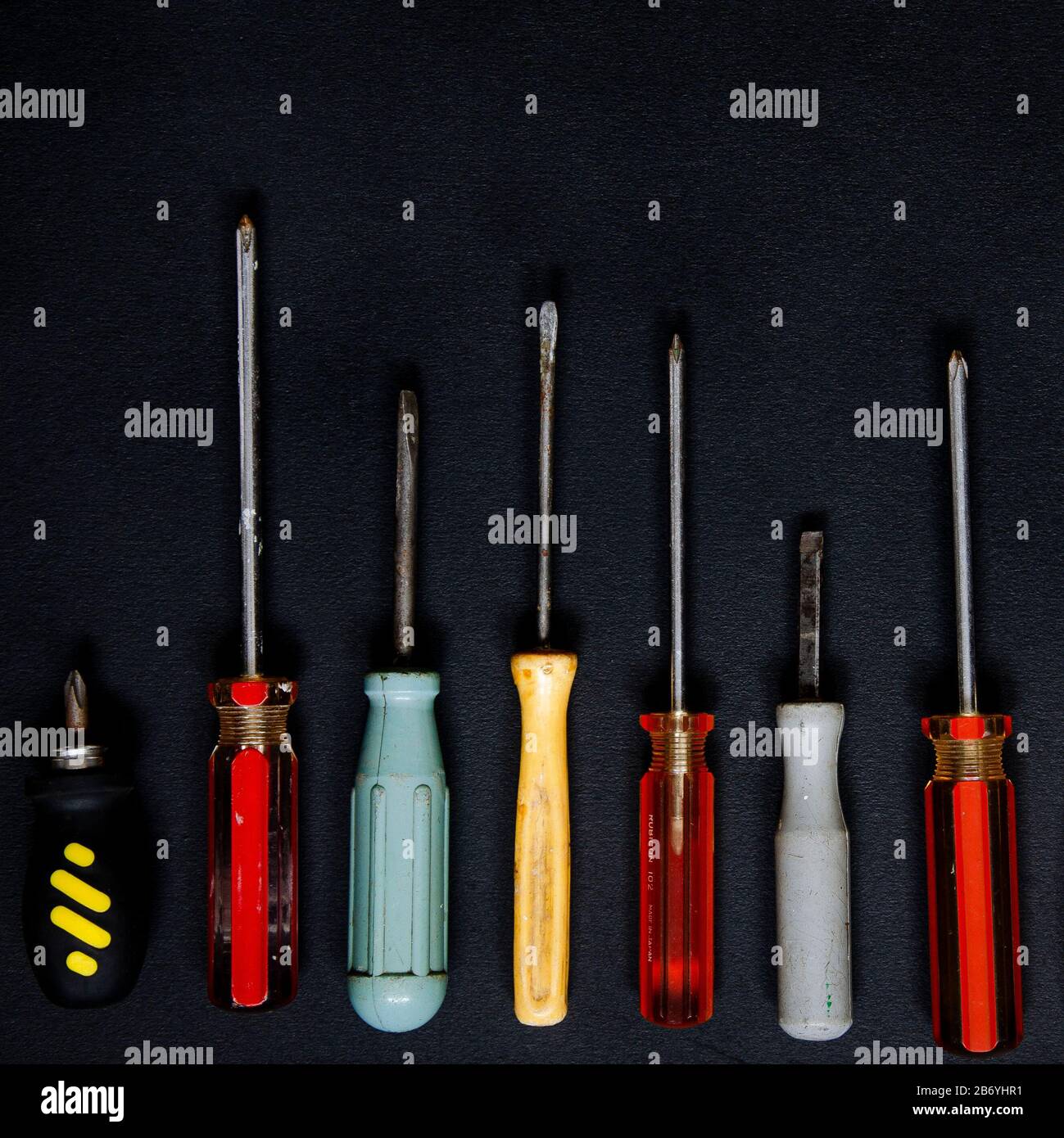 Screwdrivers of different shapes, sizes and colors for repair and ...