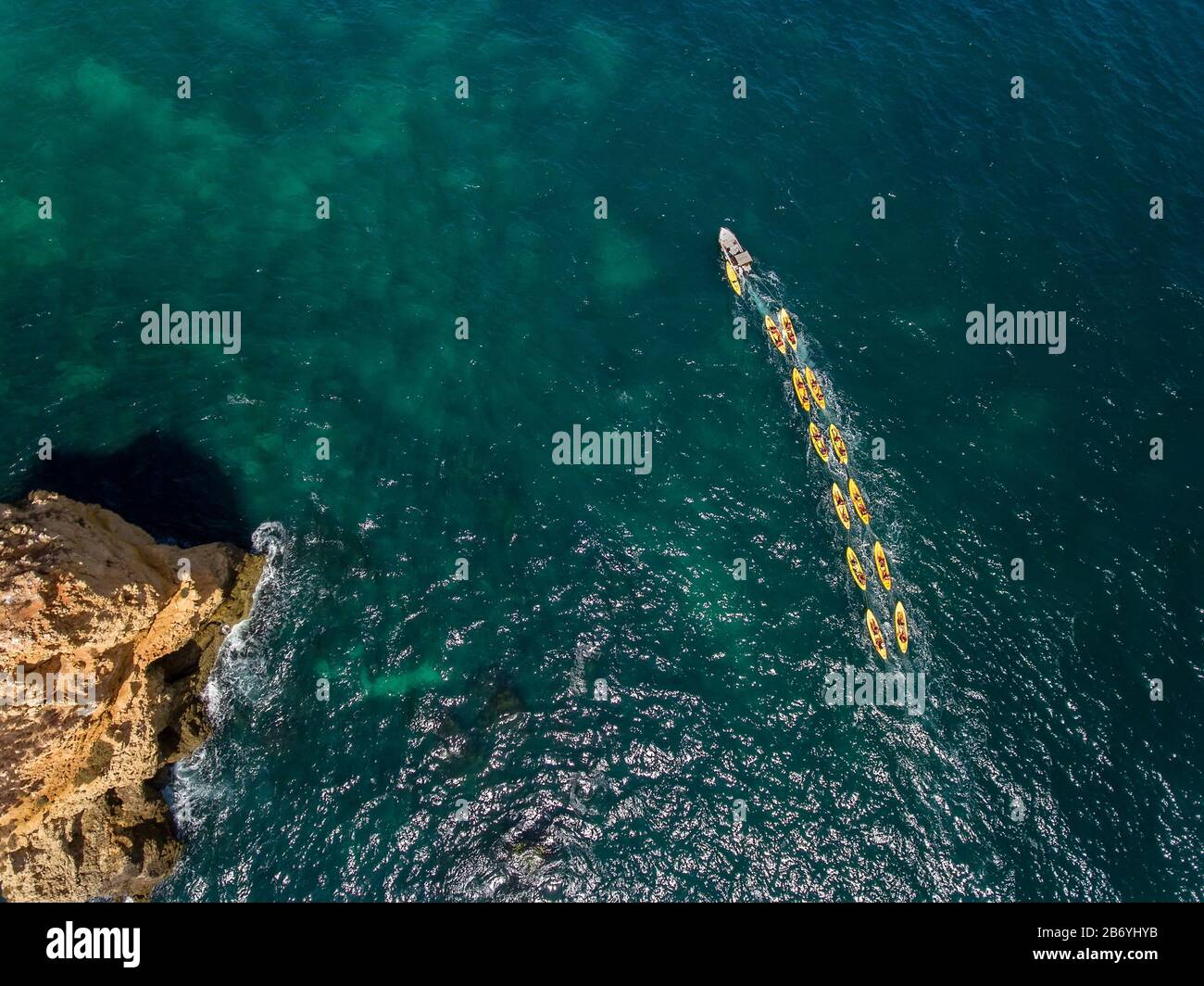 Aerial view, kayak boats in a row, sailing in Lagos Bay Ponta de ...