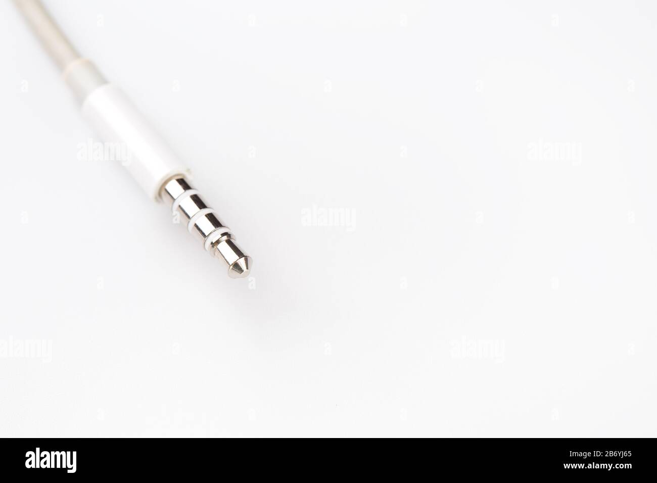 Isolated white aux cable on white background Stock Photo - Alamy