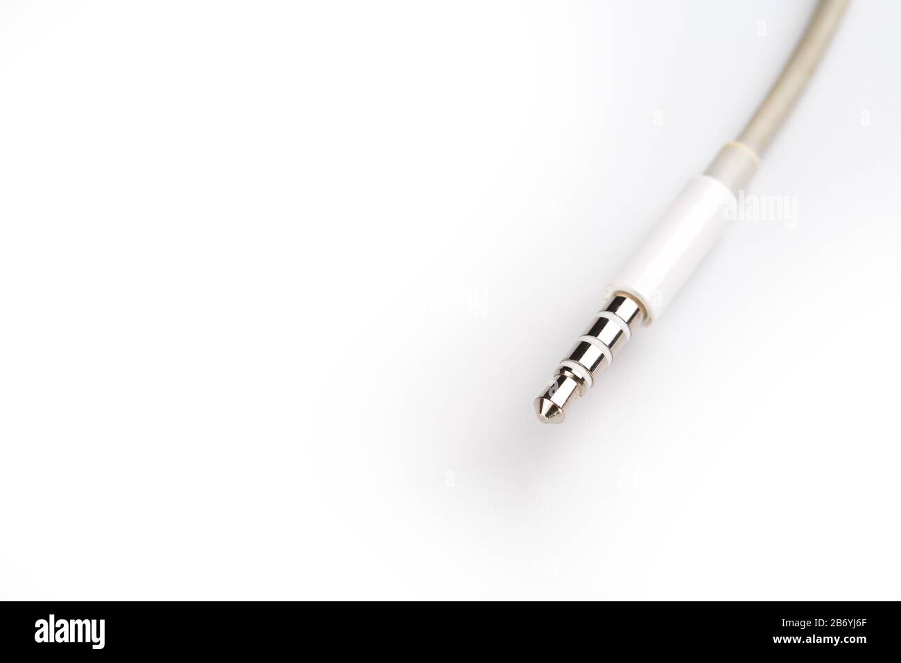 Isolated white aux cable on white background Stock Photo - Alamy