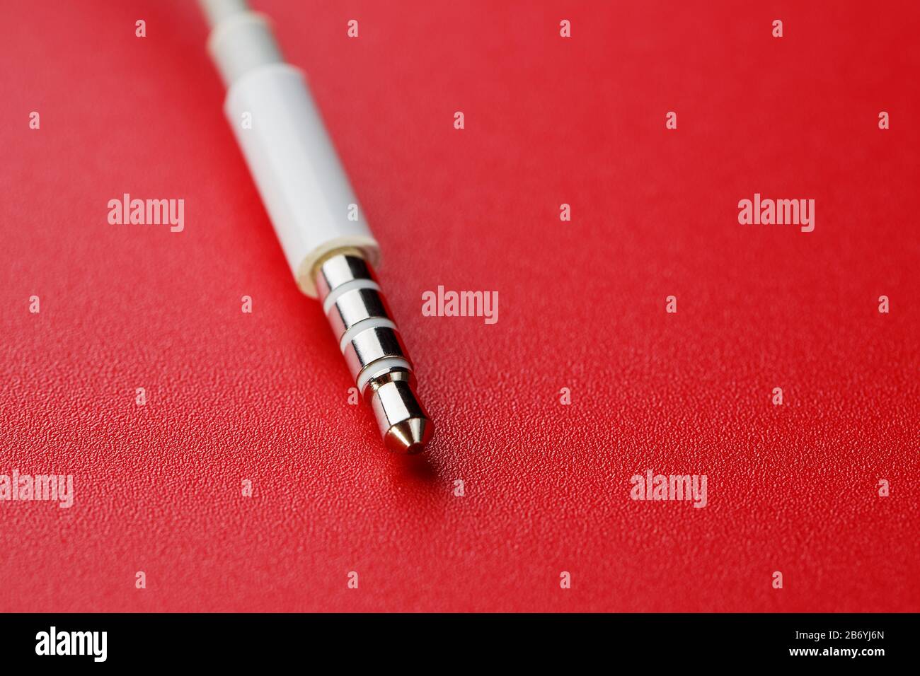 White connector auxiliary white cable on a red background Stock Photo ...