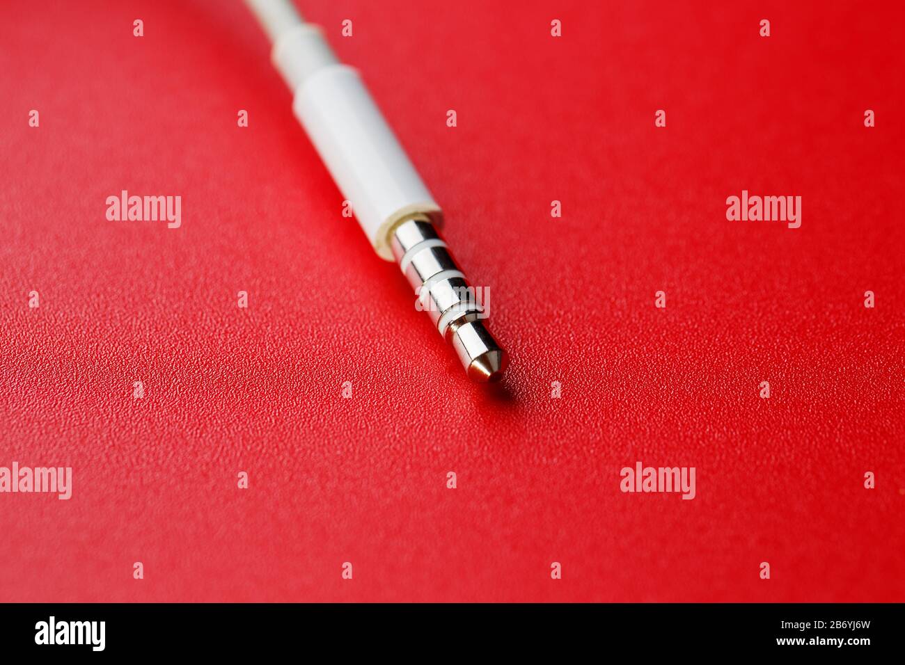 White connector auxiliary white cable on a red background Stock Photo ...