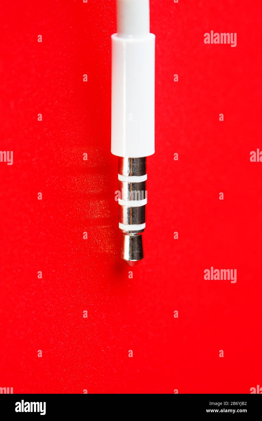 White connector auxiliary white cable on a red background Stock Photo ...