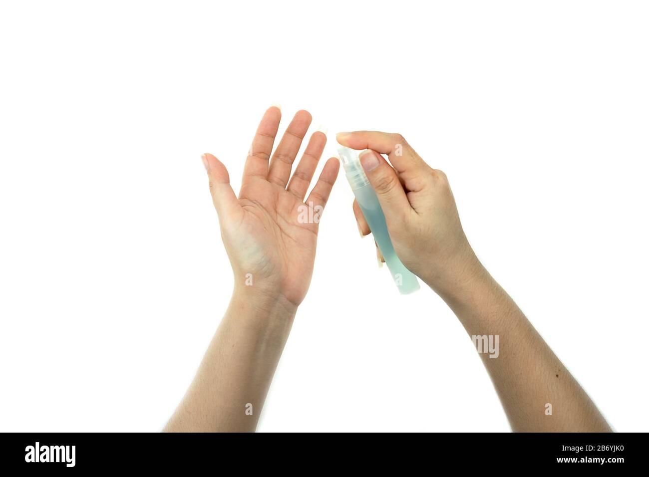 Hand of woman that applying alcohol spray from the plastic bottle or ...