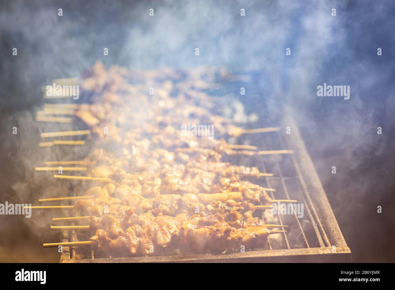 Chicken chunks skewers, grill, barbecue. On a metal bbq. In the ...