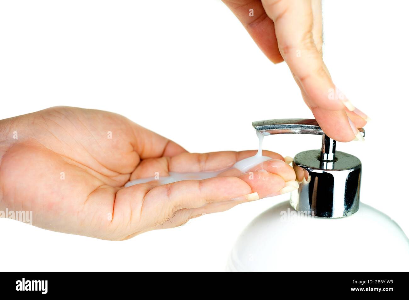Woman hand pumping lotion from the bottle a whip liquid soap at white ...